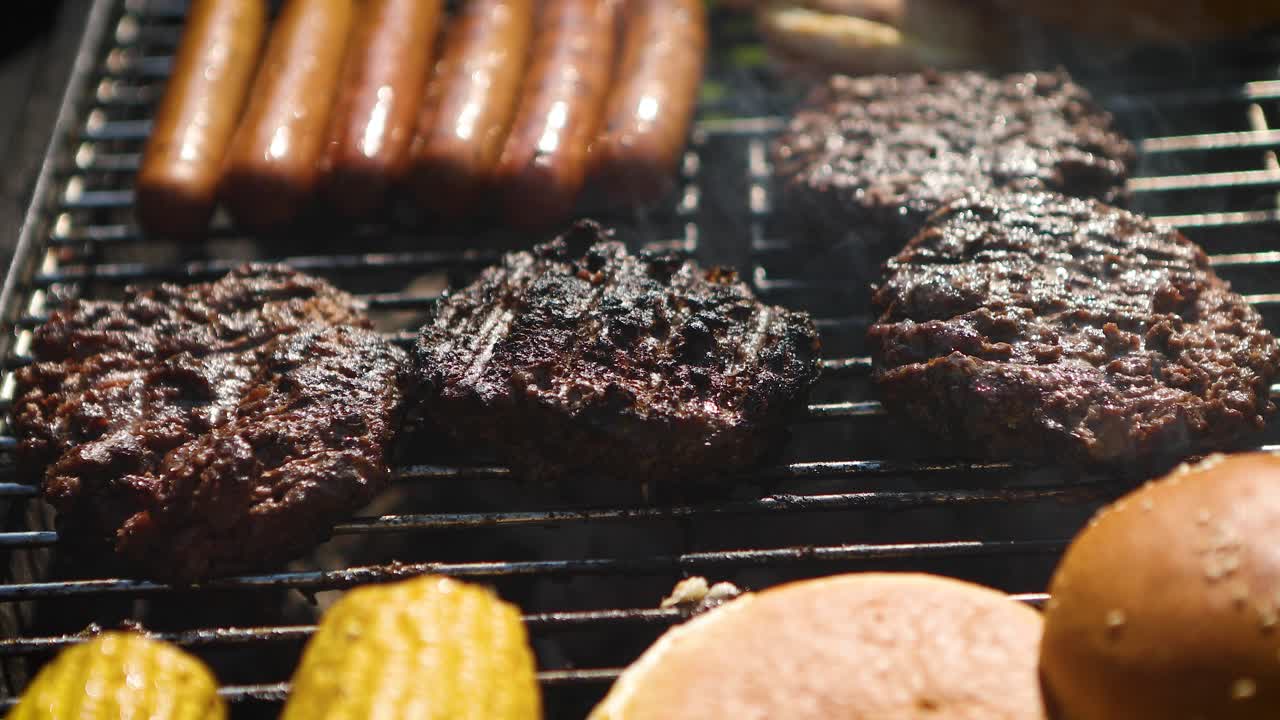 Premium stock video - Mixed american barbecue food on hot grill