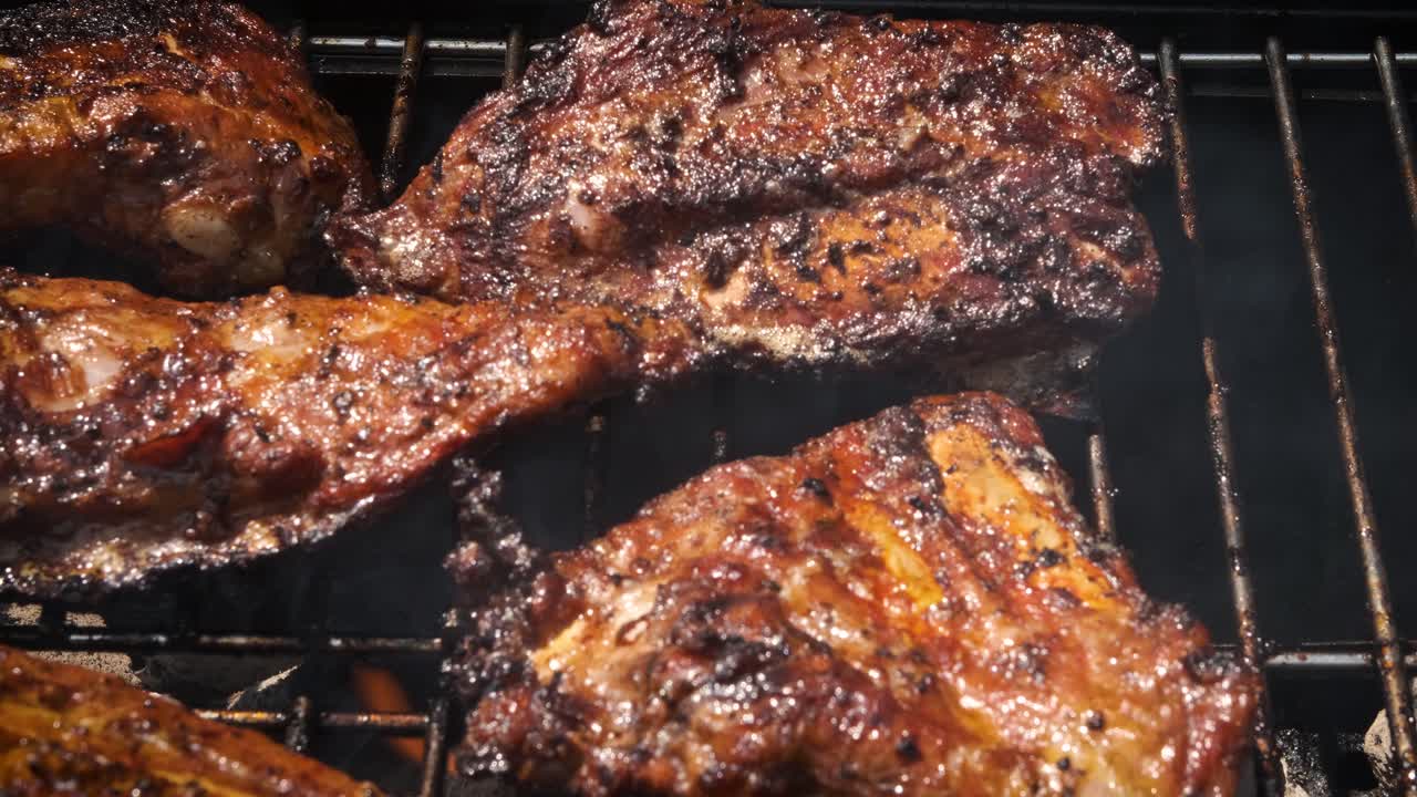 Premium stock video - Tasty ribs cooking on barbecue grill for summer ...