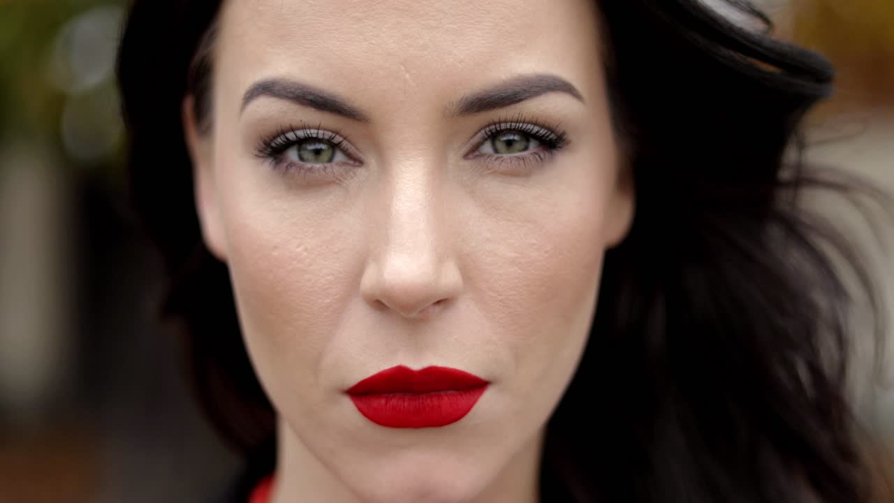 Premium stock video - Serious woman with vivid makeup