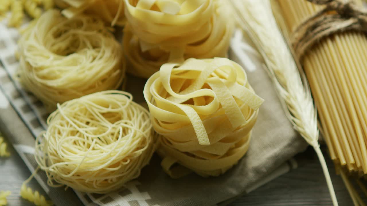 Premium stock video - Spaghetti in shape of rolls