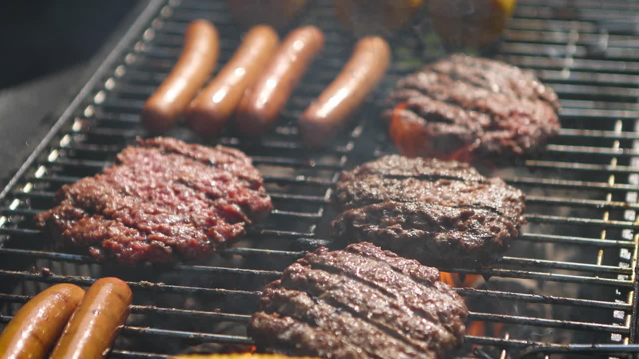 Premium stock video - Mixed american barbecue food on hot grill