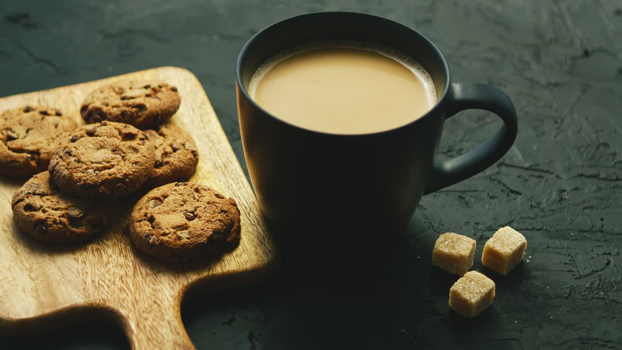 Premium stock video - Cup of coffee with cookies