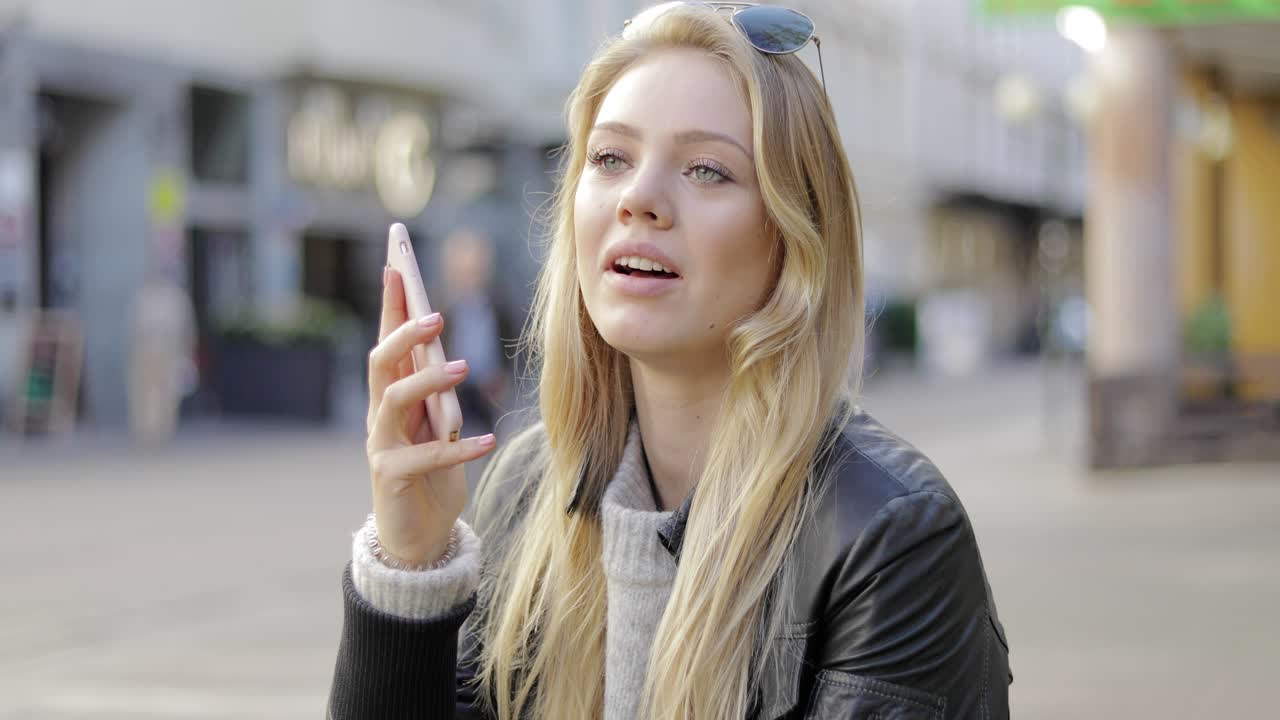 Premium stock video - Pretty woman speaking on phone