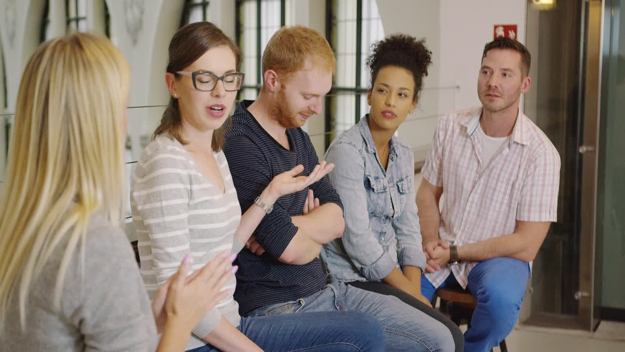 Premium stock video - People laughing at jokes during break
