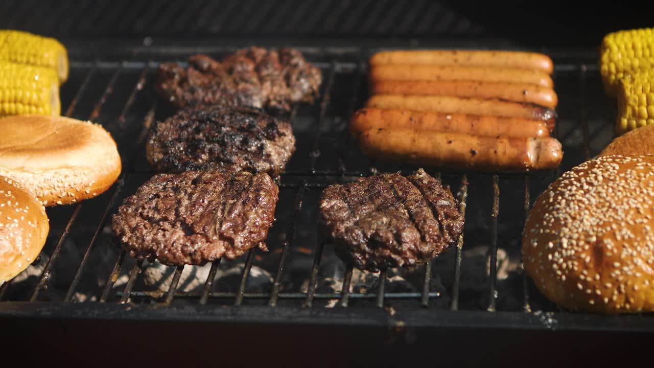 Premium stock video - Mixed american barbecue food on hot grill