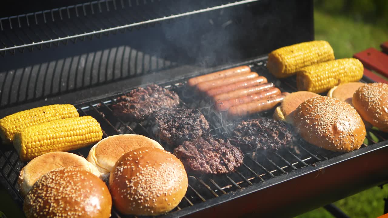 Premium stock video - Mixed american barbecue food on hot grill