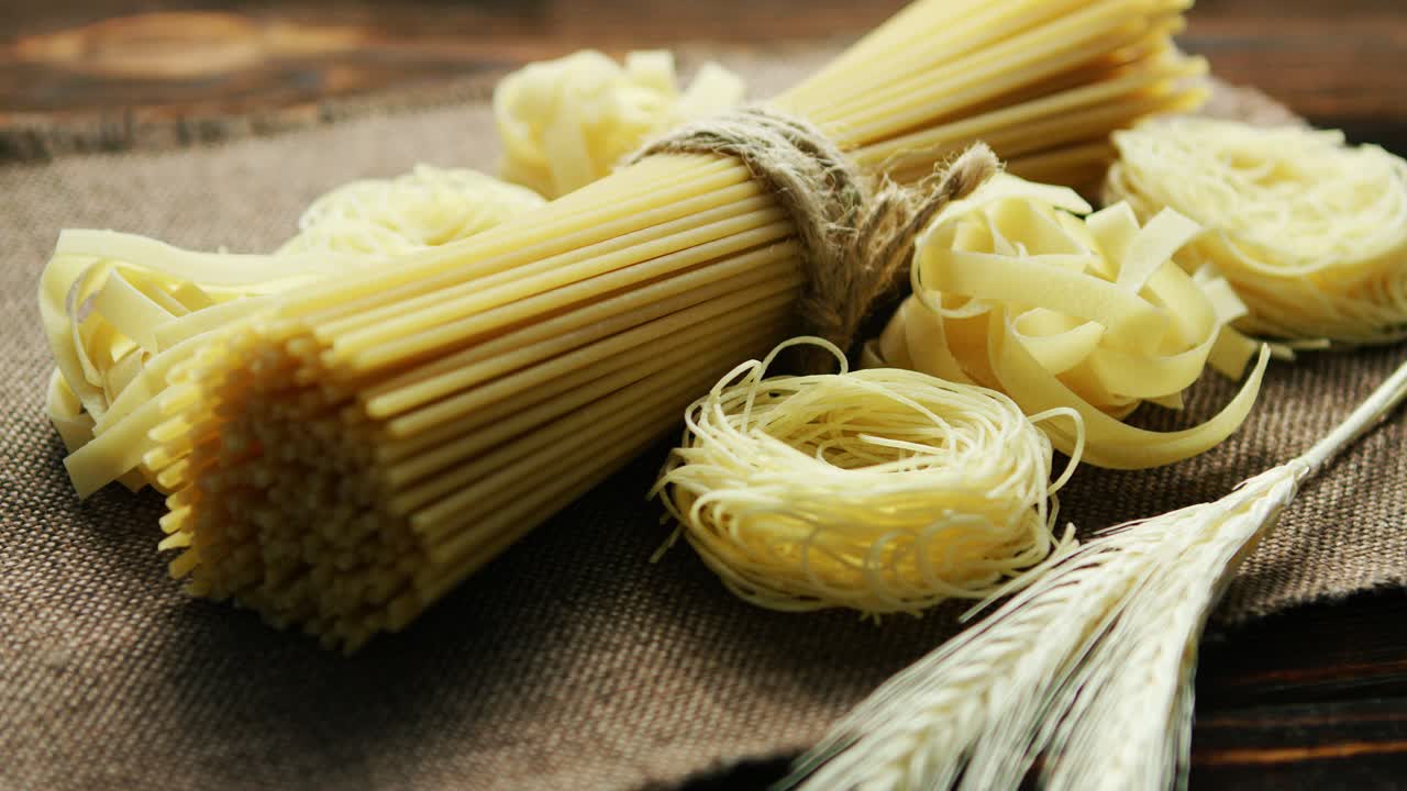 Premium stock video - Spaghetti in shape of rolls