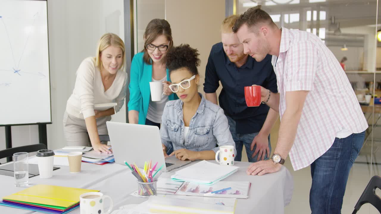 Premium stock video - People watching laptop with interest