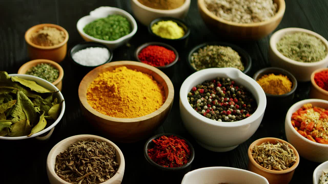 Premium stock video - Many bowls with different spices