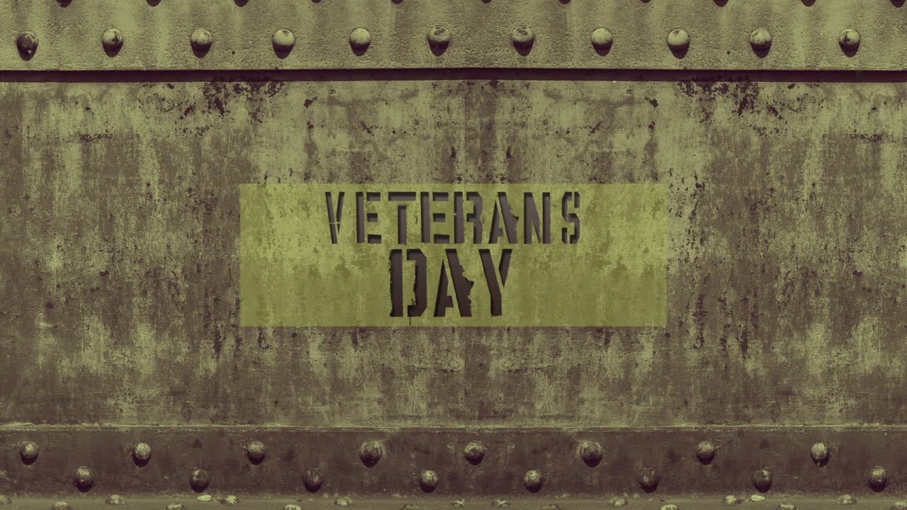 Premium stock video - Animation text veterans day on military background