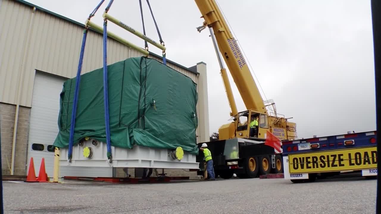 A Large Fuel Cell Module Is Loaded Onto A Truck For Delivery Free Stock ...