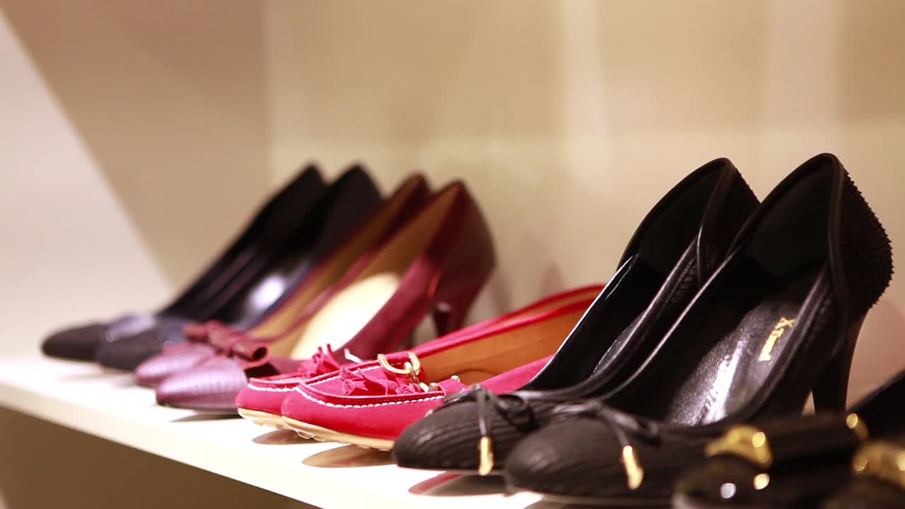 Premium stock video - Women's clothing store shoes section 3