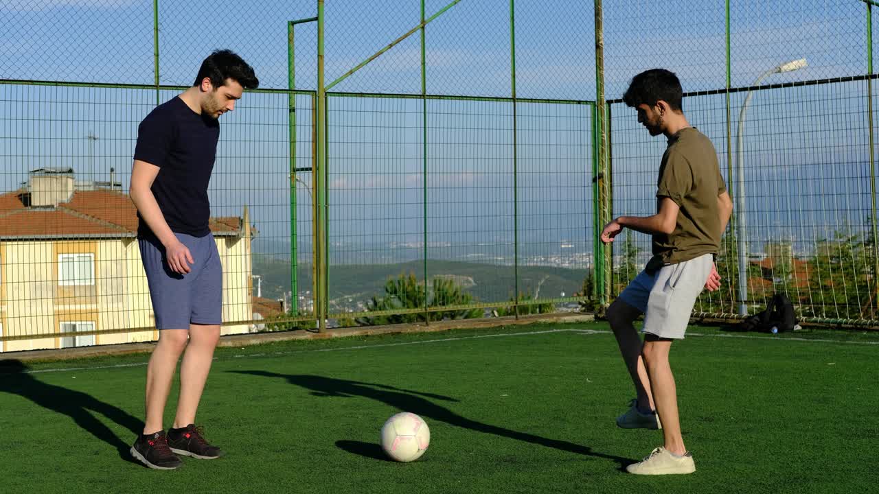 Premium stock video - Two young man football player