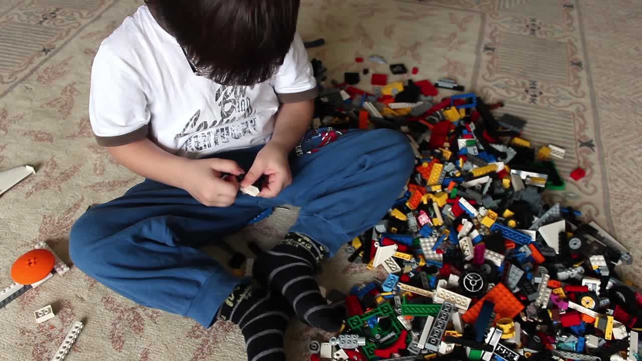Premium stock video - Kids playing lego toys