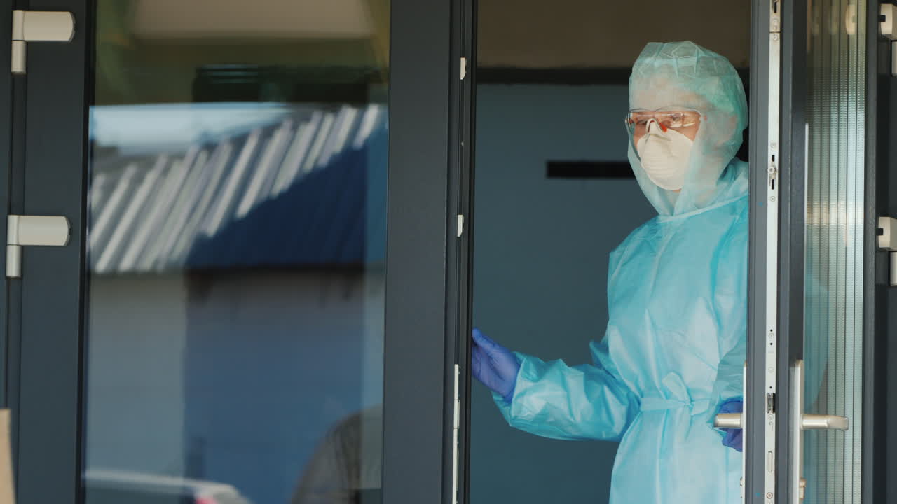 Premium stock video - Loading boxes of medicine at the clinic door 1