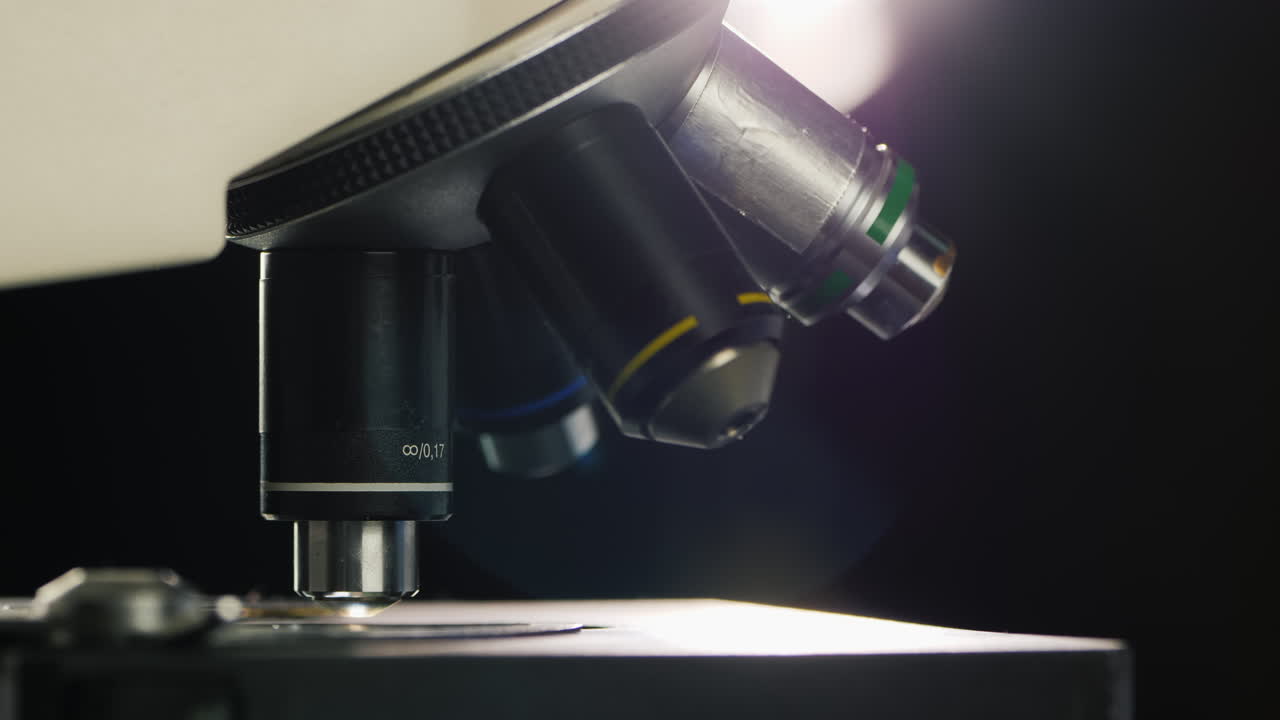 Premium stock video - Side view of of a scientist working with a ...