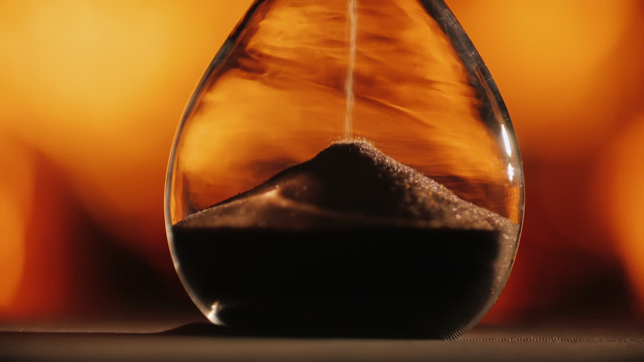Premium stock video - Slow motion video of hourglass clock 1
