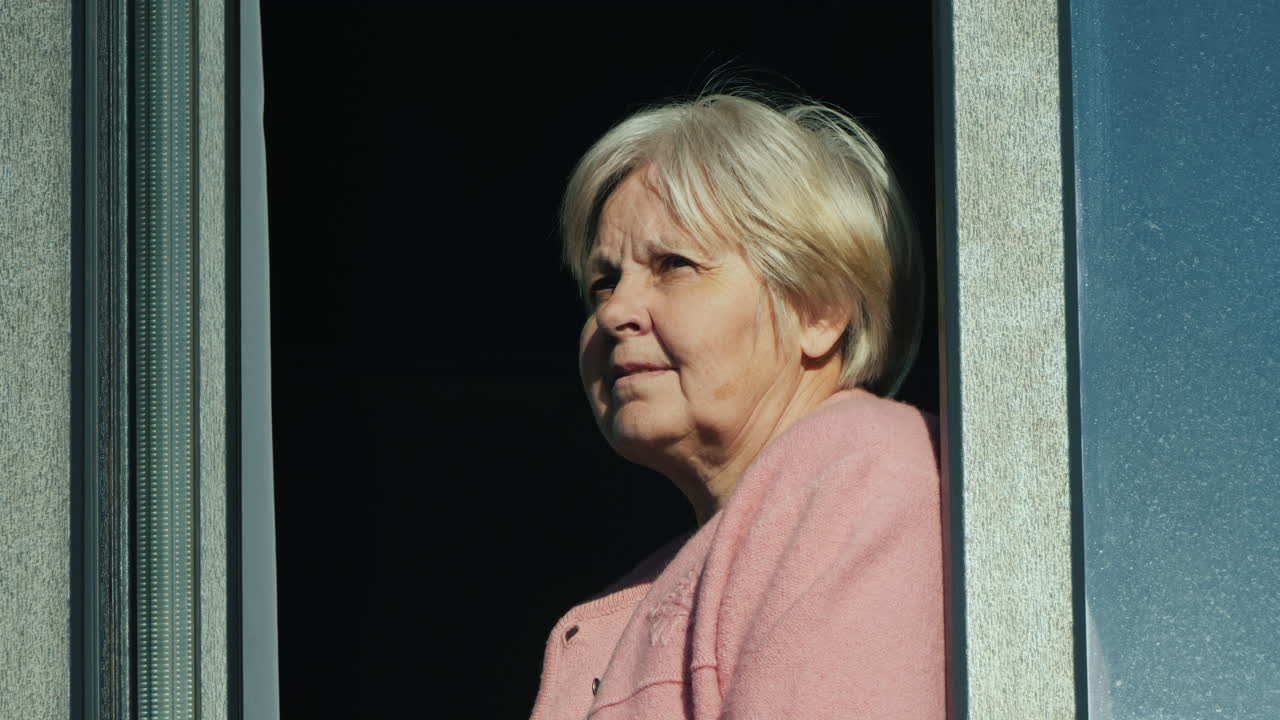 Premium stock video - Portrait of an elderly woman looking out of the ... Premium stock video - Portrait of an elderly woman looking out of the ...