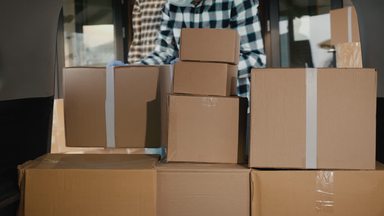 Premium stock video - Warehouse staff unload boxes of medicine