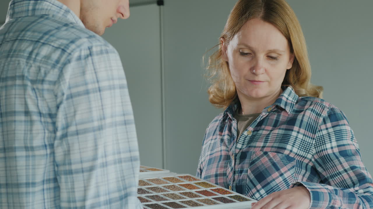 Premium stock video - The customer chooses the color of his order by ...