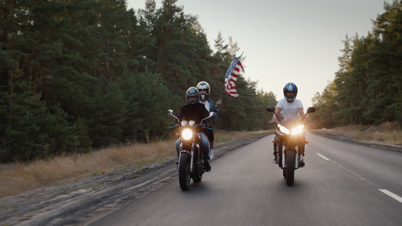 Premium stock video - Young people on high-speed motorcycles ride on ...