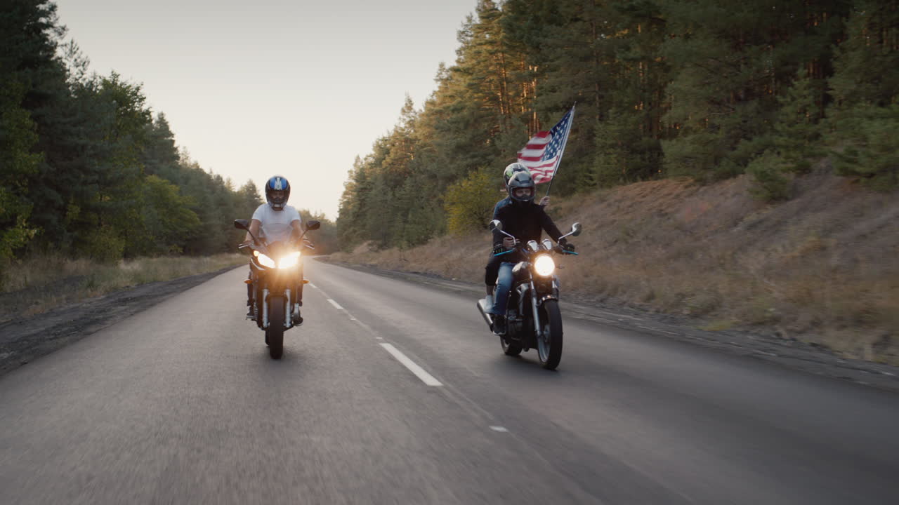 Premium stock video - Young people on high-speed motorcycles ride on ...