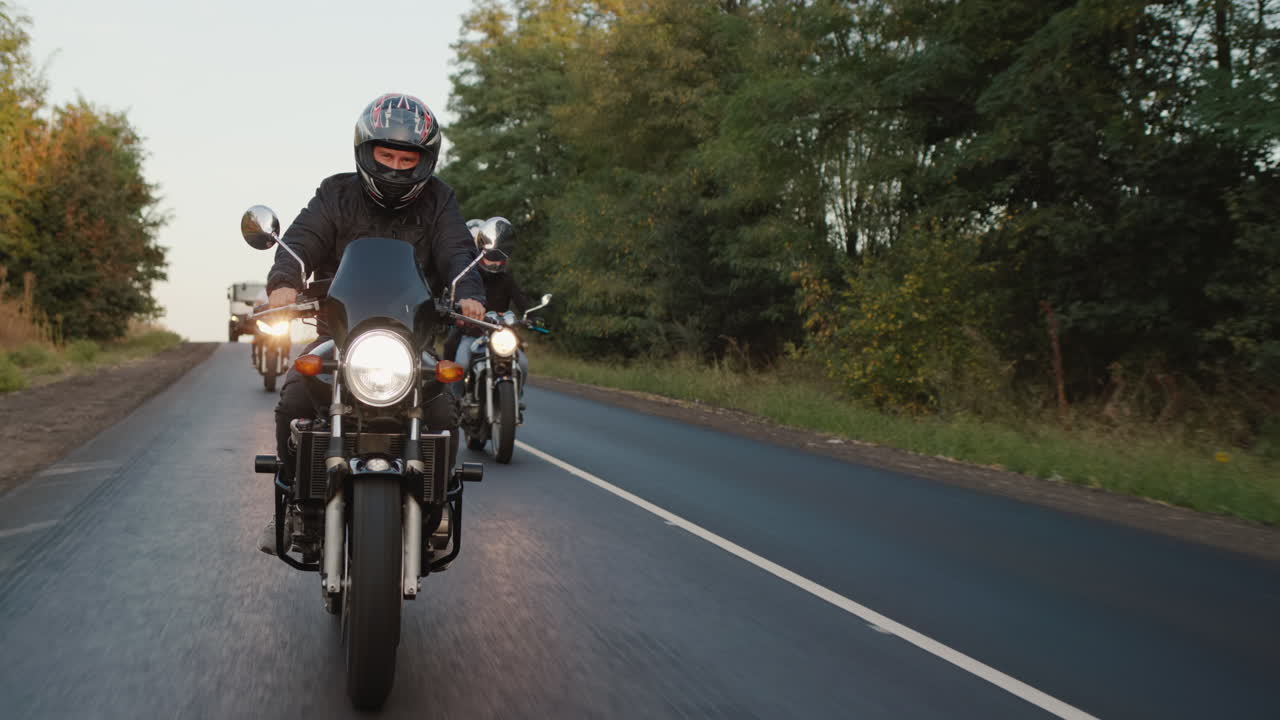 Premium stock video - Young people travel on motorcycles in a ...