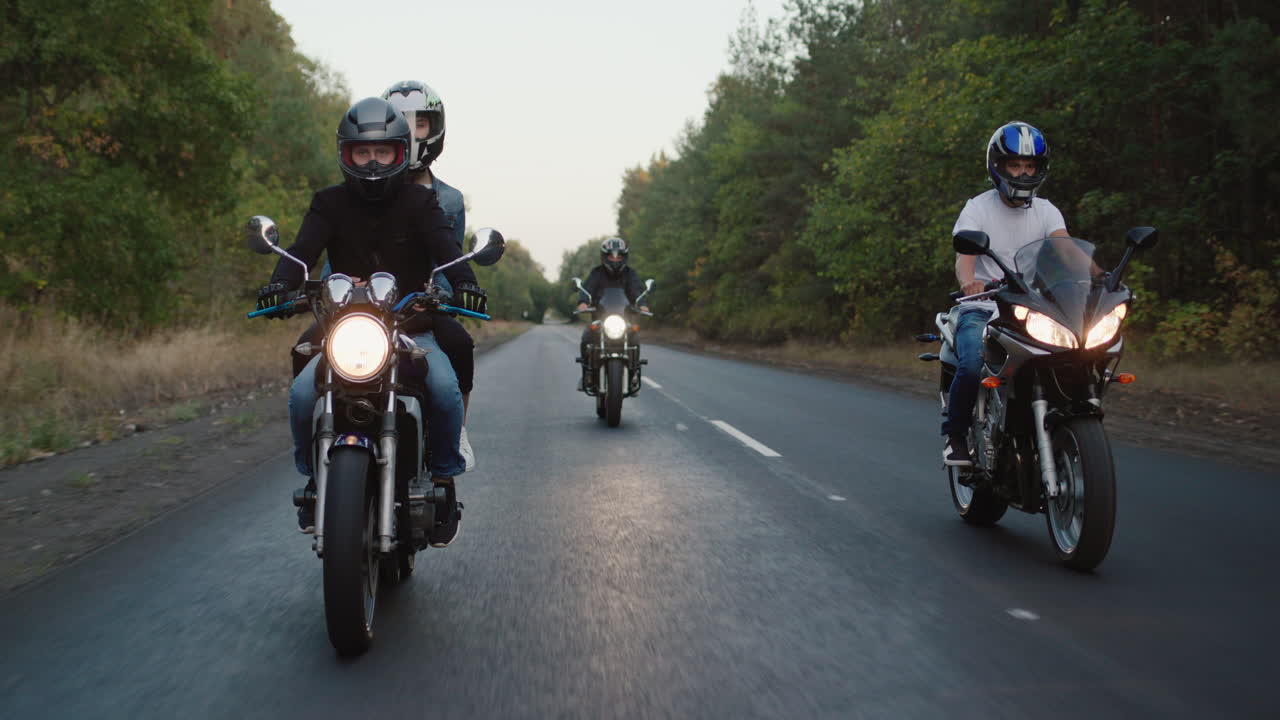 Premium stock video - Young people travel on motorcycles in a ...