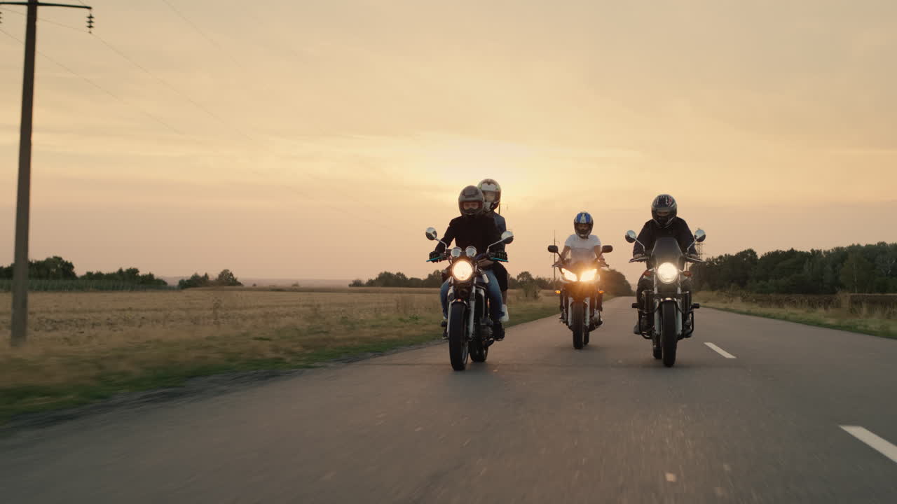 Premium stock video - Bikers ride in a row on the highway