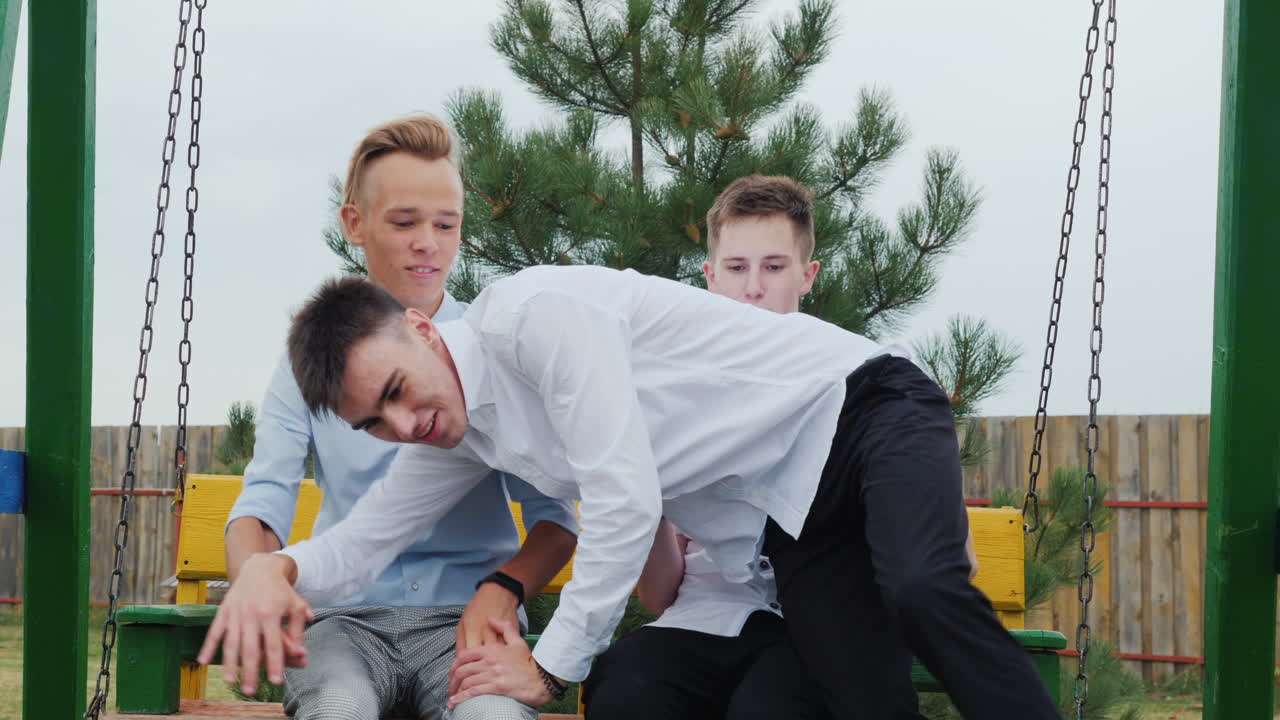 Premium stock video - High school graduates having fun fooling around ...