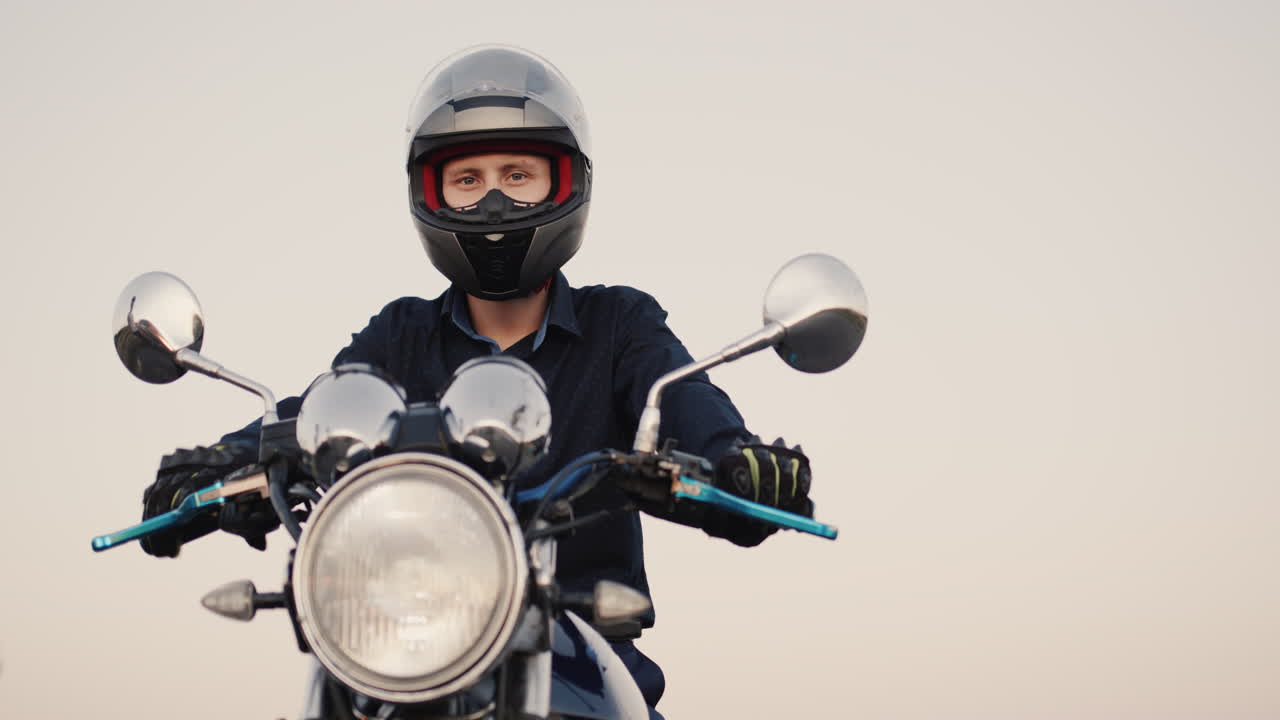 Premium stock video - Portrait of a young biker getting ready for a ...