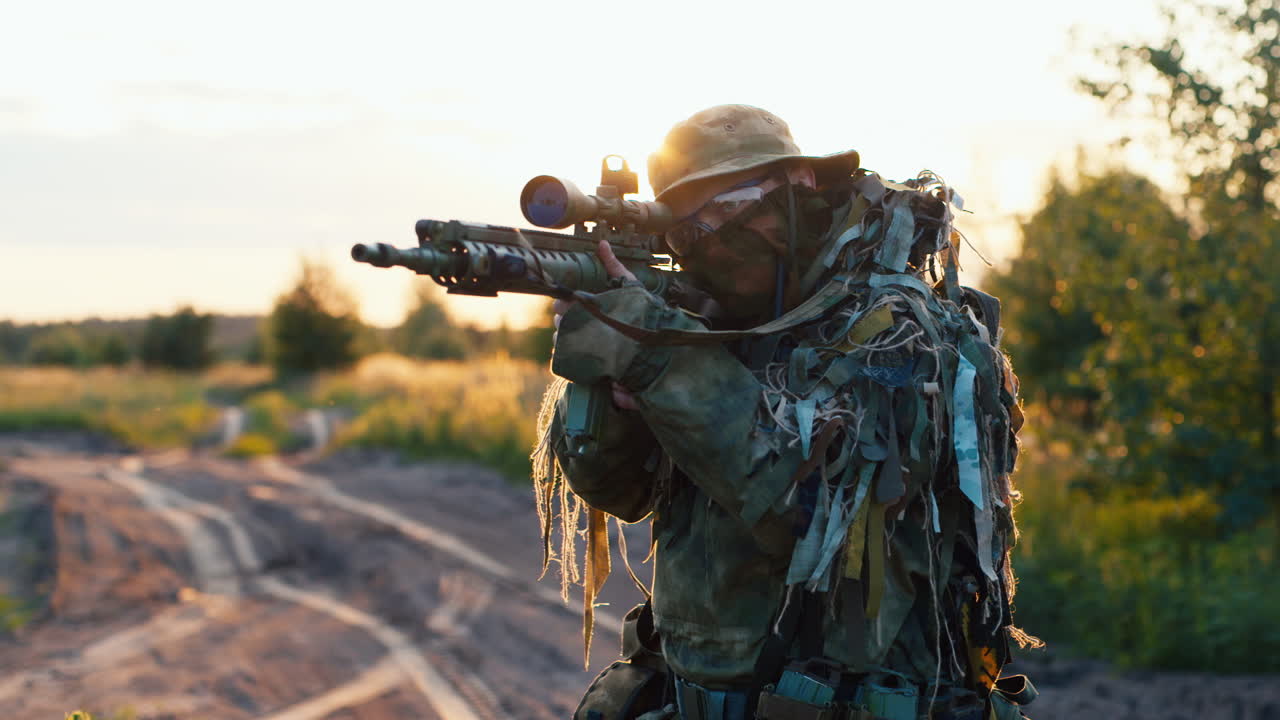 Premium stock video - Soldier fires a rifle 1