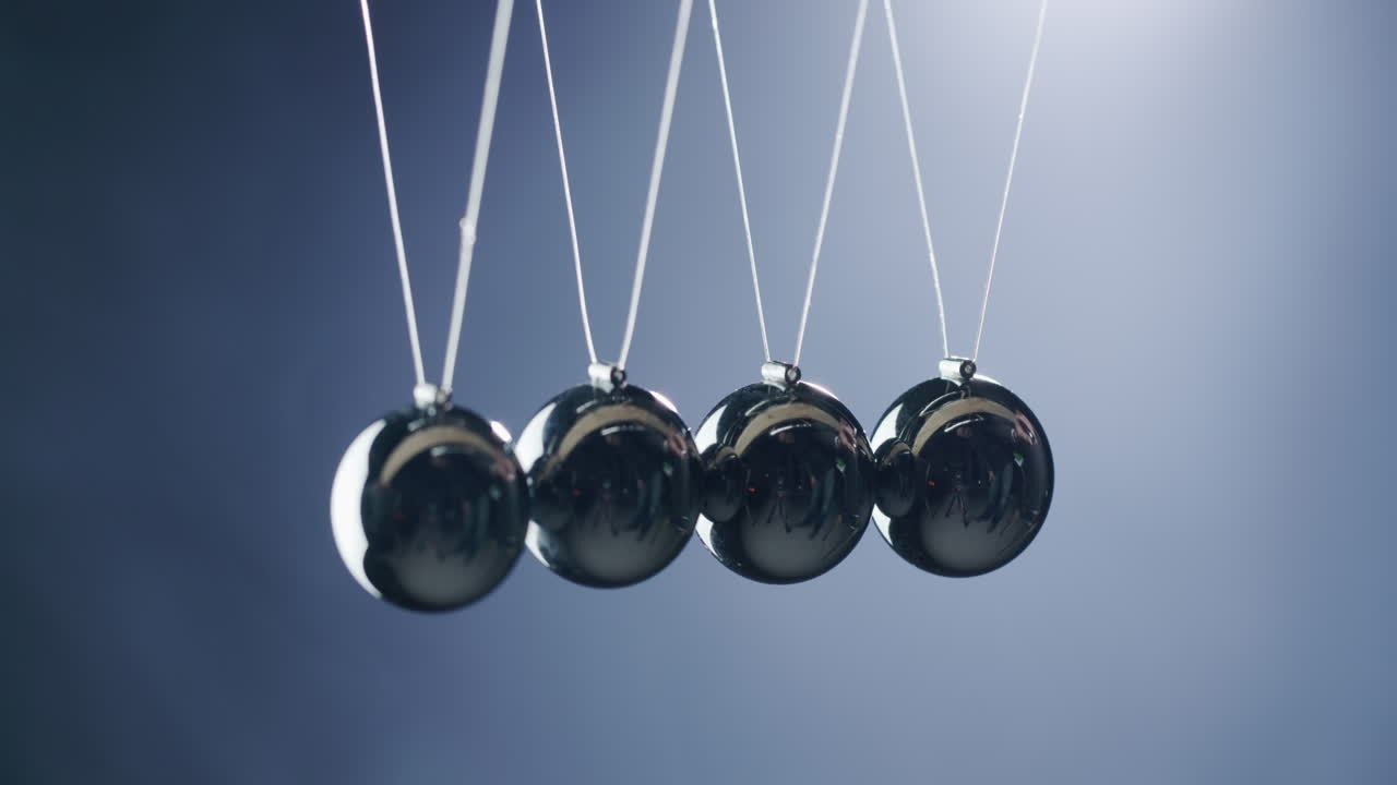 Premium stock video - Newton's cradle - demonstrates the law of ...