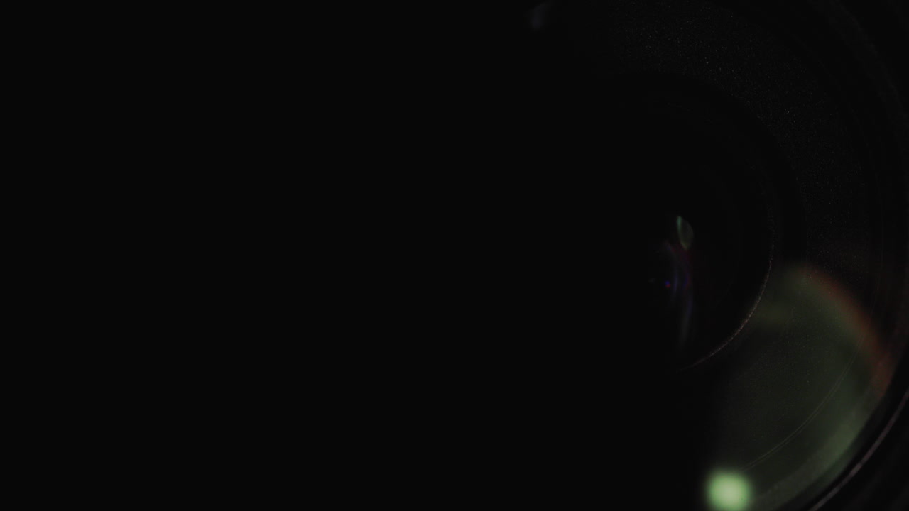 Premium stock video - The front lens of the lens is illuminated by a ...