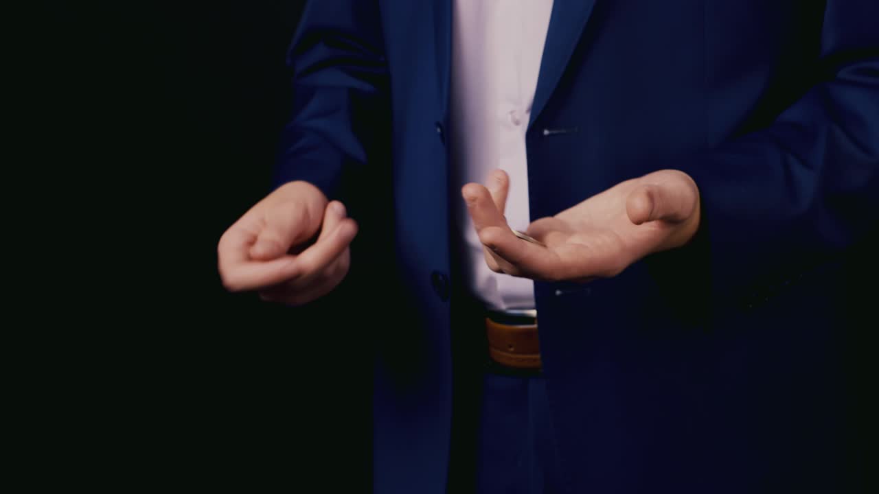 Premium stock video - Dexterous magician does card tricks