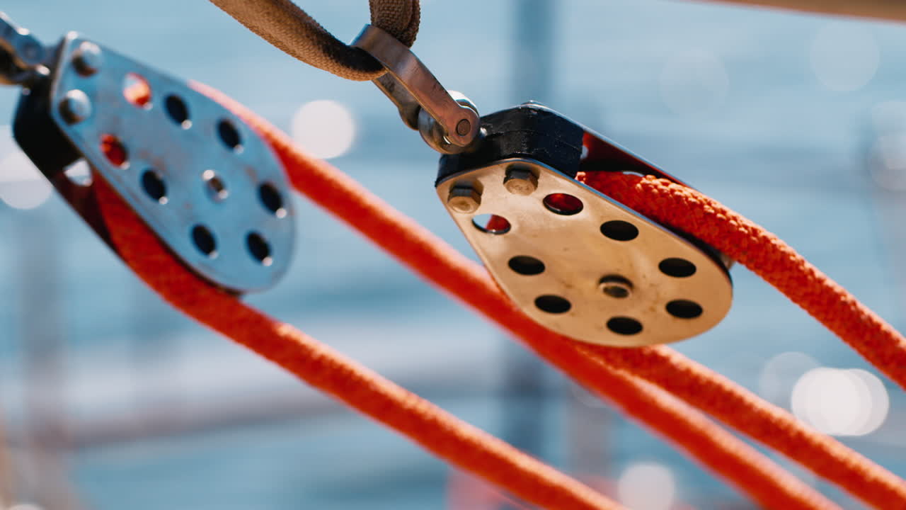 Premium stock video - Rigging with ropes and blocks on the yacht