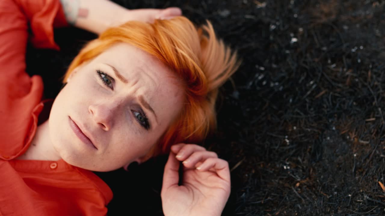 Premium stock video - Portrait of sad tired woman looking into the camera 1