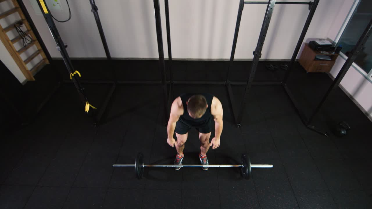 Premium stock video - Athlete does exercises in the gym 3