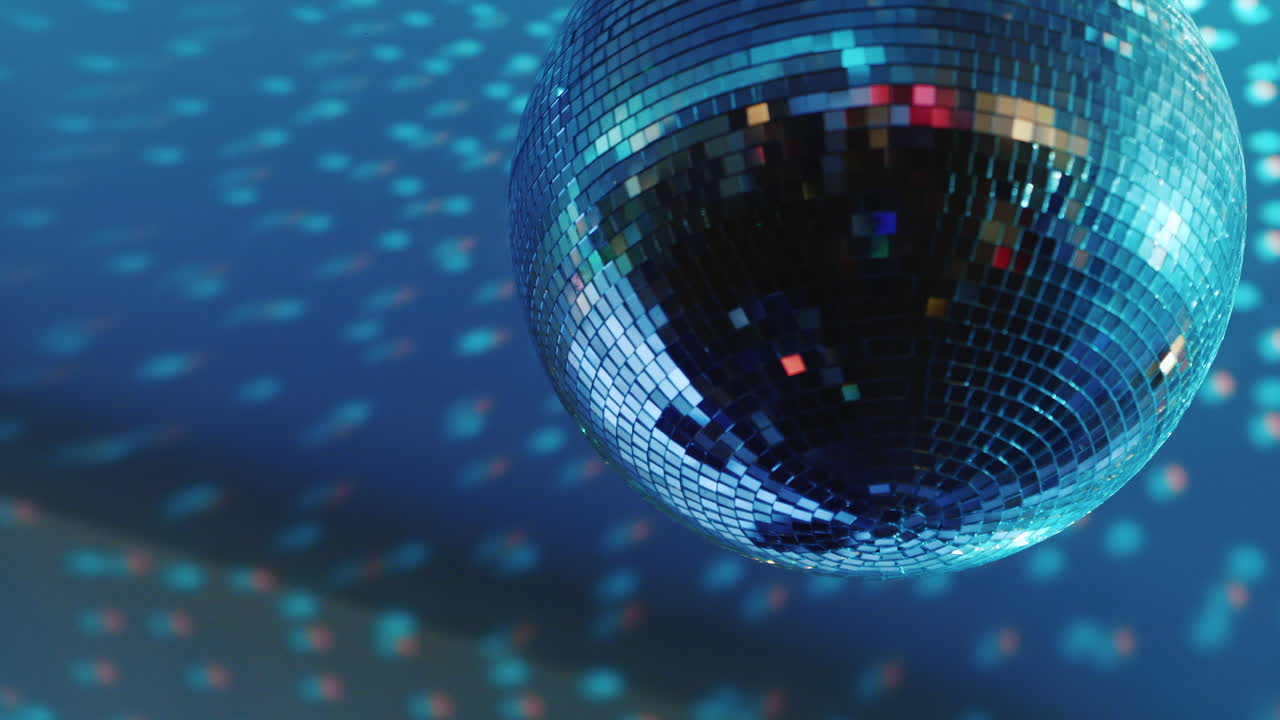Premium stock video - Mirror ball reflects light and spins