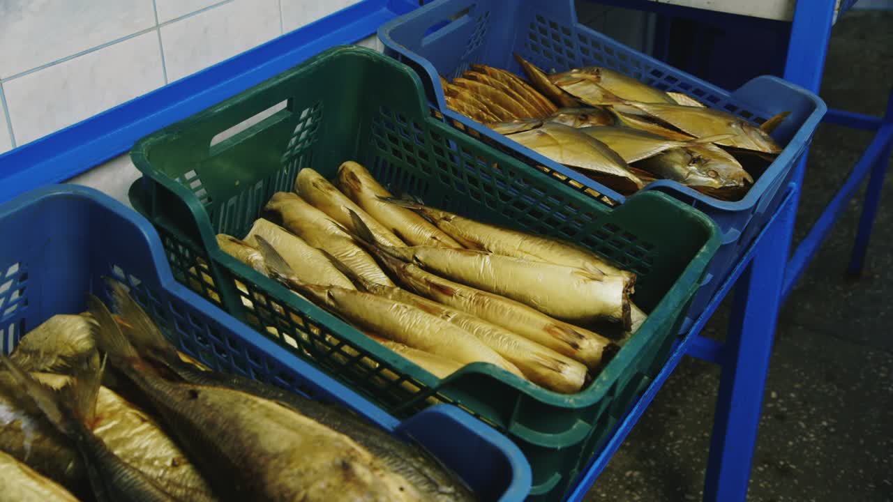 Premium stock video - Boxes with smoked fish in stock