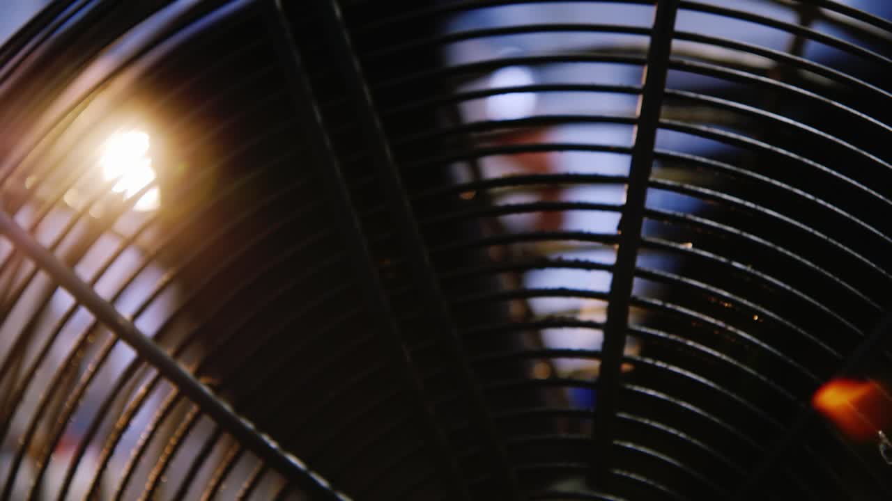 Premium stock video - Rays of light shine through the blades of a ...