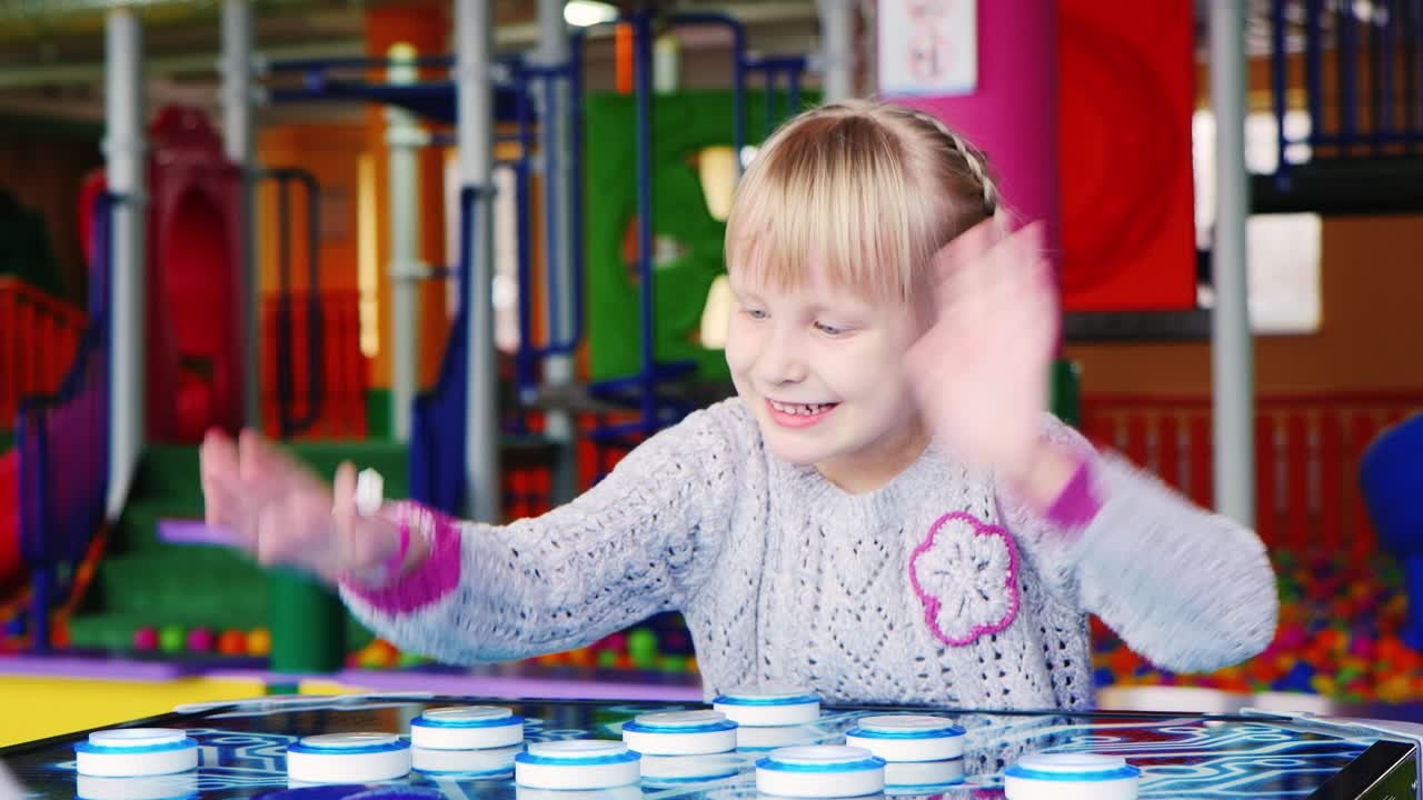 Premium stock video - Child is having fun playing a board game