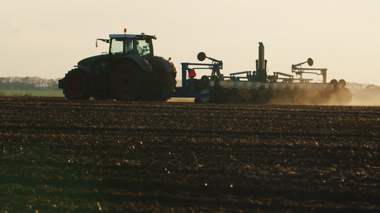 Premium stock video - Tractor plows through the soil 4