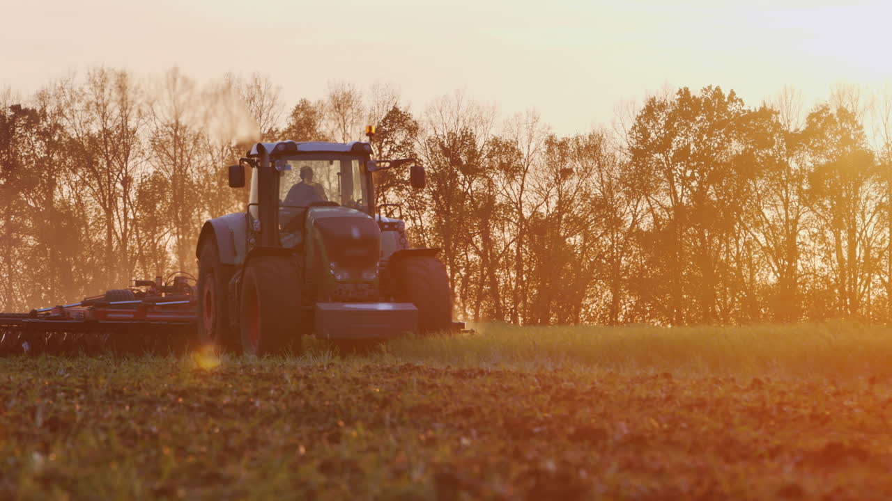 Premium stock video - Tractor plows through the soil 11