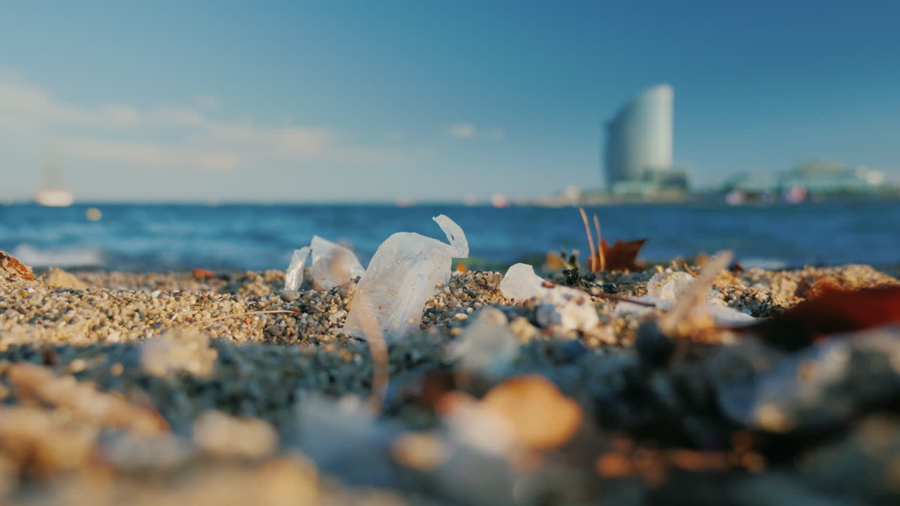 Premium stock video - Plastic and other garbage on the beach in barcelona
