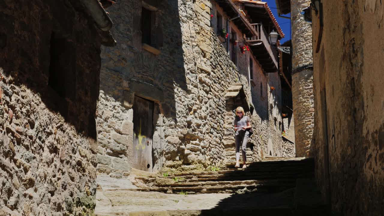 Premium stock video - A tourist walks through the narrow streets of the ...