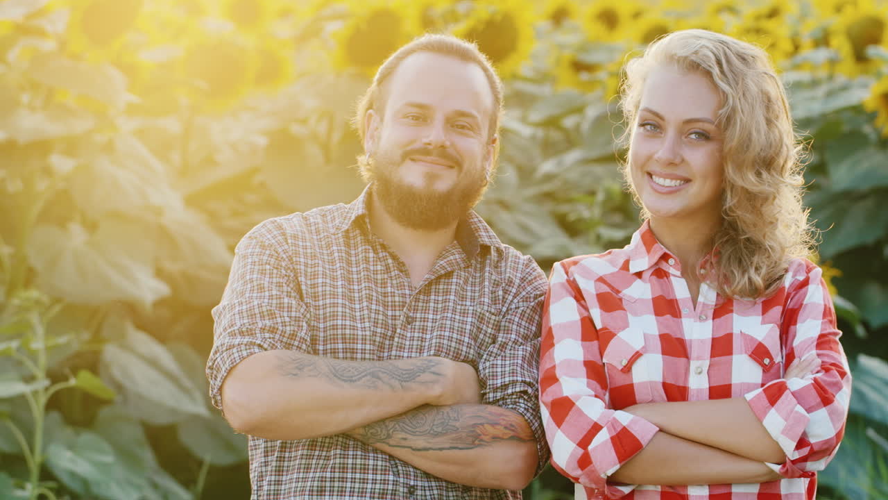 Premium stock video - Portrait of two farmers in a field of flowering ...