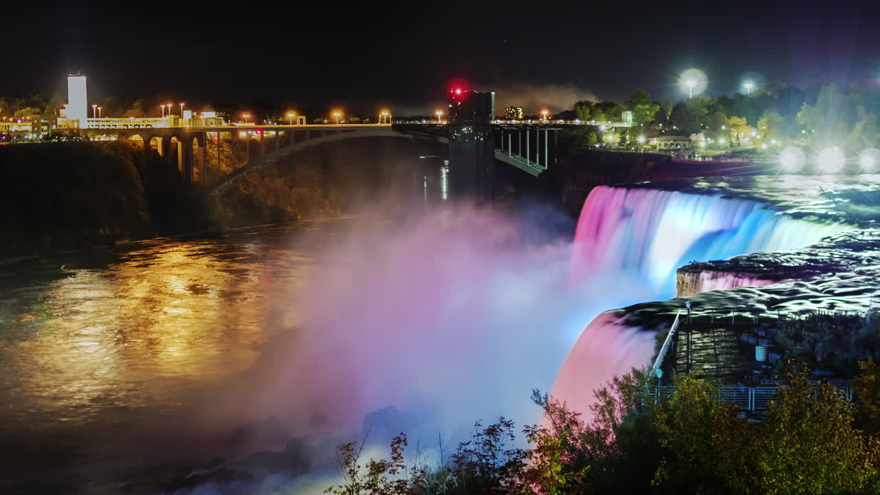 Premium stock video - Niagara falls at night with the glow of the city ...