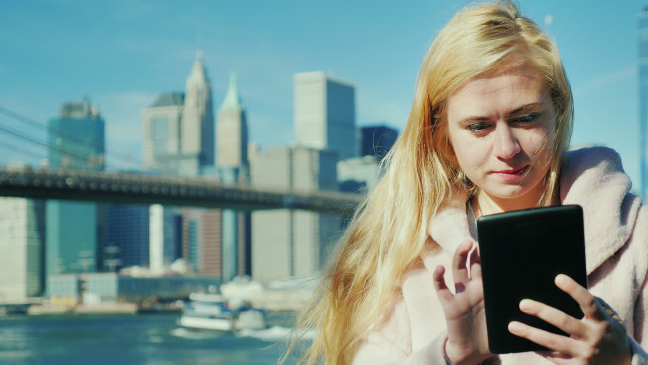 Premium stock video - Portrait of young woman using tablet