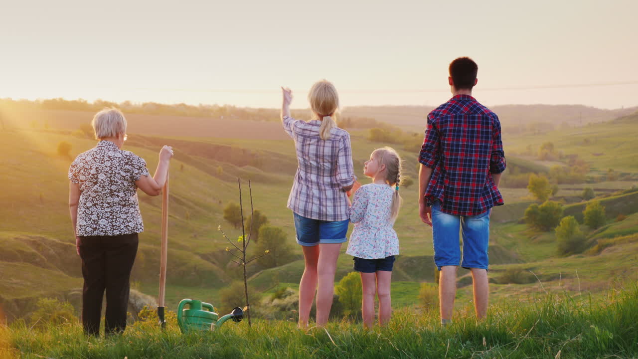 Premium stock video - Several generations the family comes with tree ...